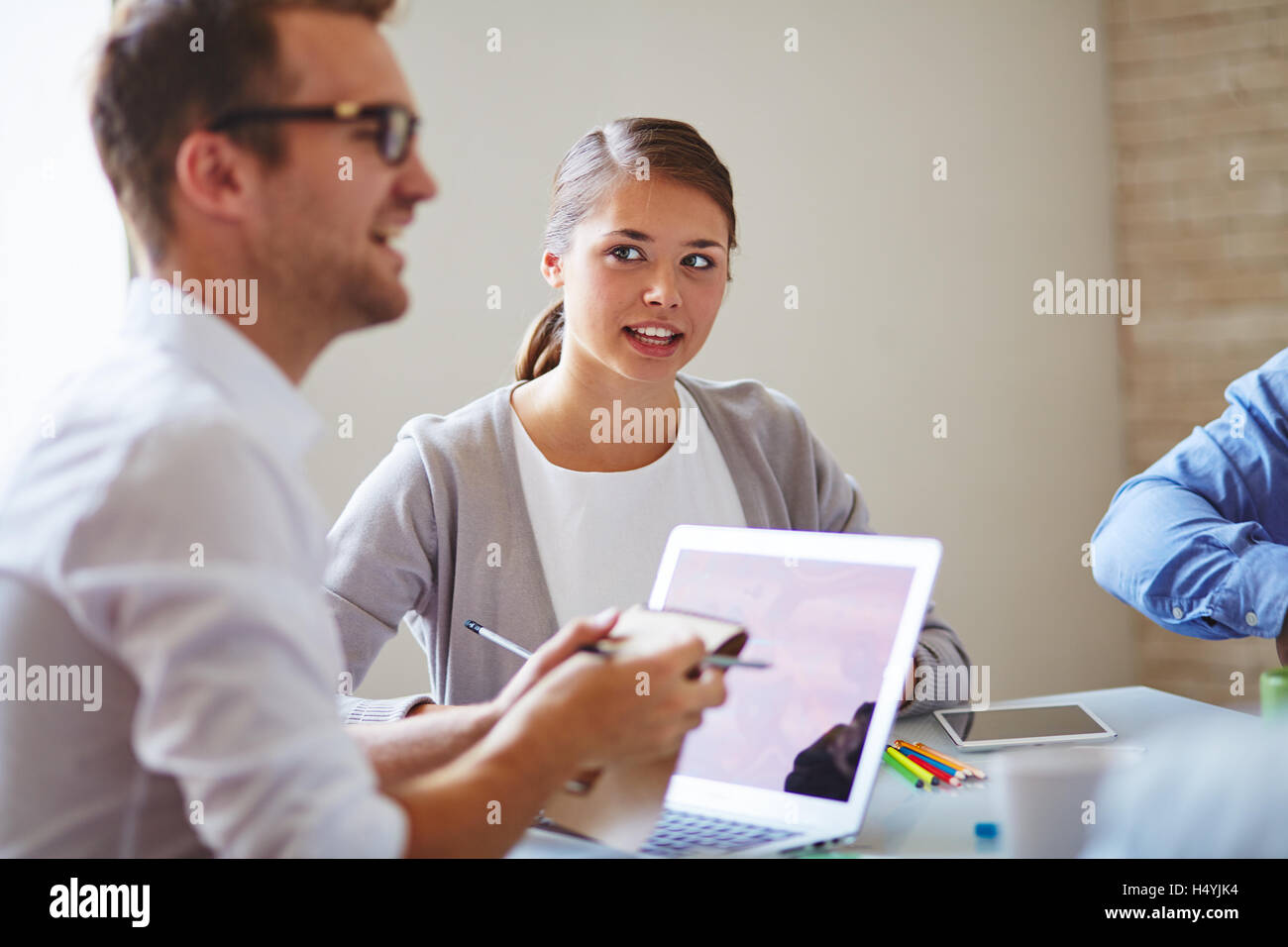 Young co-workers discussing data and new ideas Stock Photo - Alamy