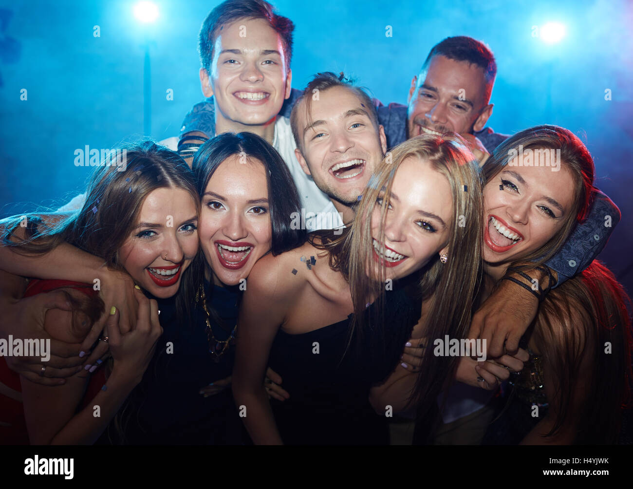 Group of ecstatic friends laughing at party in nightclub Stock Photo ...