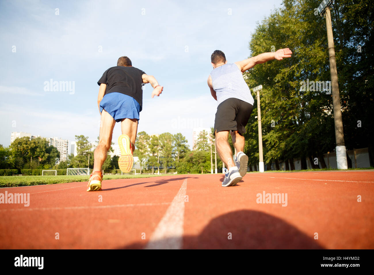 Fitness strong men jogging on running street track Stock Photo - Alamy