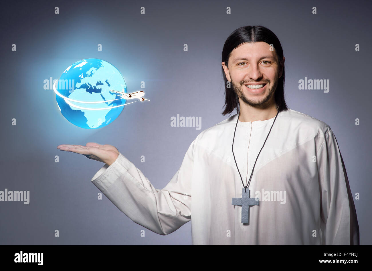 Young christian priest in air travel concept Stock Photo - Alamy