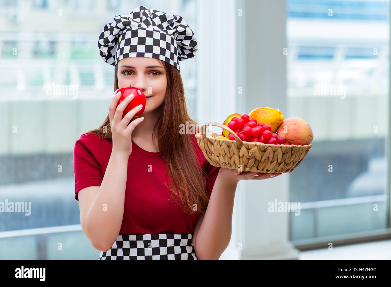 Young cook with fruits in the kitchen Stock Photo - Alamy