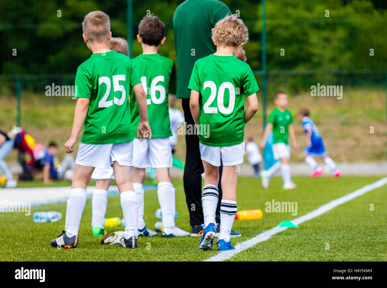 Youth Football Team With Coach. Boys As Reserve Players Stock Photo - Alamy