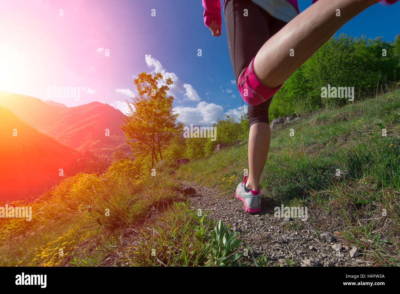 Detail of the girl's legs running in nature Stock Photo - Alamy