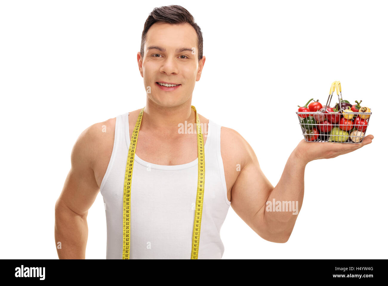 Handsome young guy posing with a measuring tape and a small shopping ...