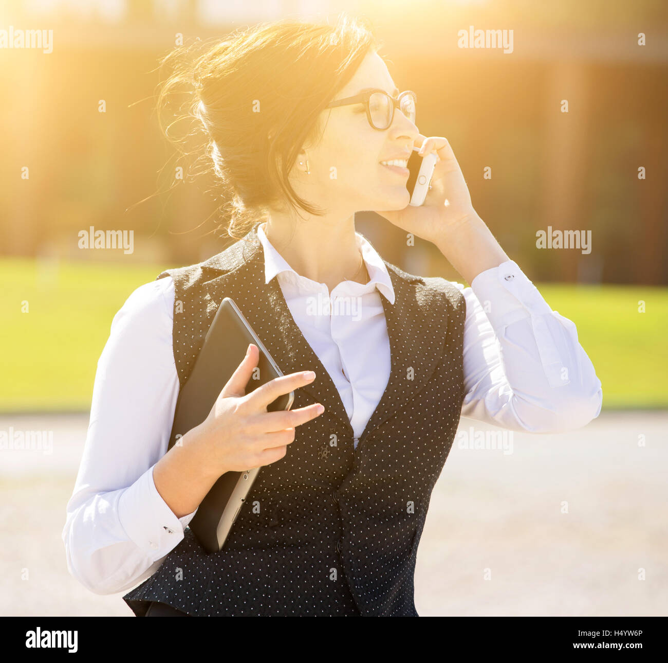 Portrait of a young smiling business woman Stock Photo - Alamy Portrait of a young smiling business woman Stock Photo - Alamy