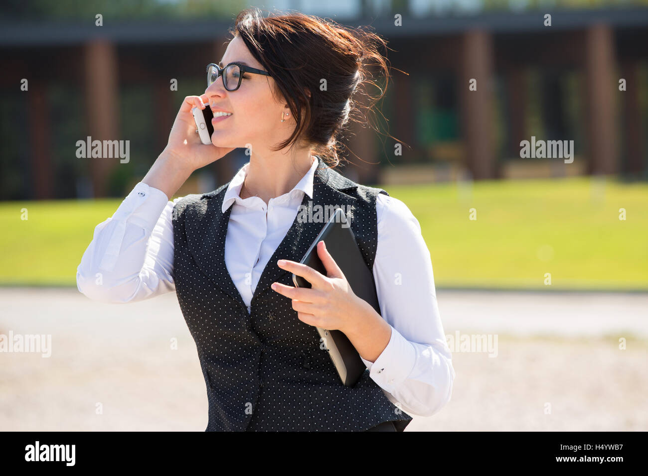 Portrait of a young smiling business woman Stock Photo - Alamy Portrait of a young smiling business woman Stock Photo - Alamy