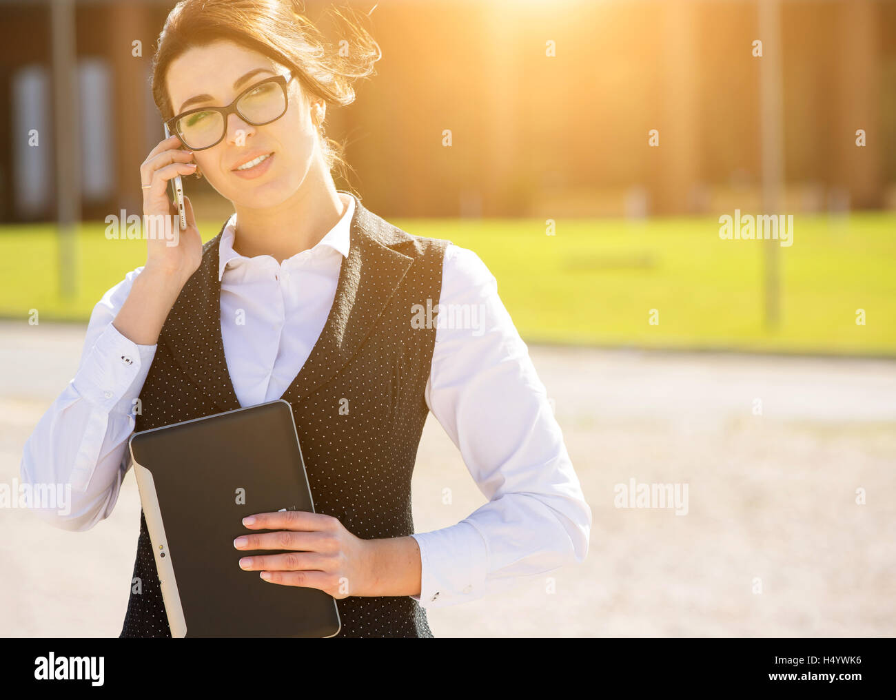 Portrait of a young smiling business woman Stock Photo - Alamy Portrait of a young smiling business woman Stock Photo - Alamy