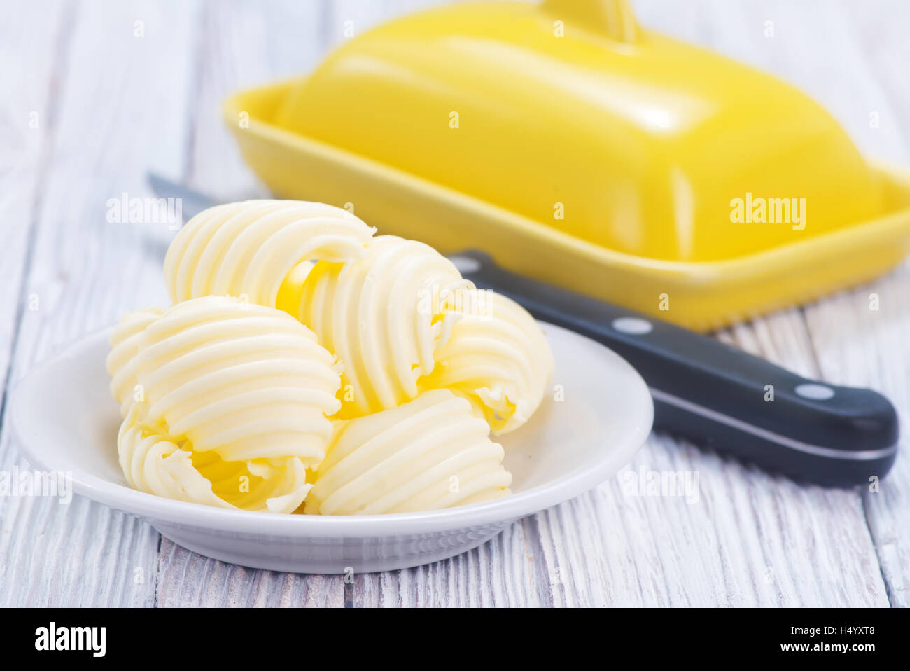 butter on plate and on a table Stock Photo - Alamy