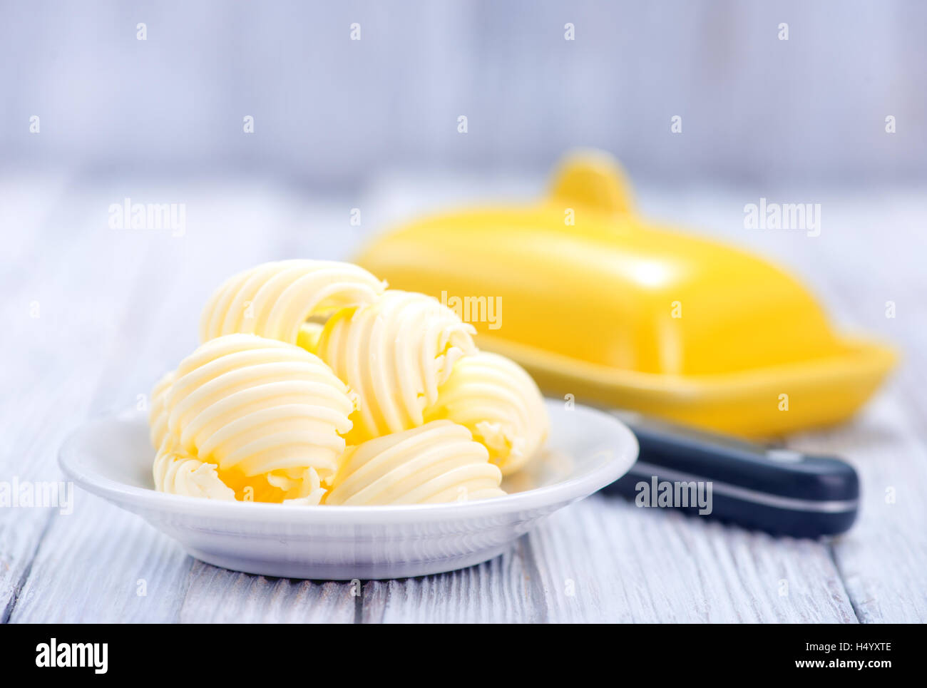 butter on plate and on a table Stock Photo - Alamy