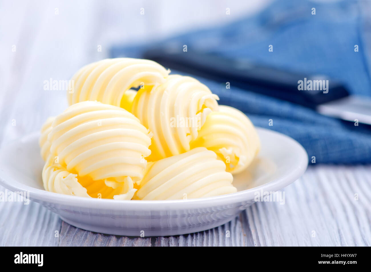 butter on plate and on a table Stock Photo - Alamy