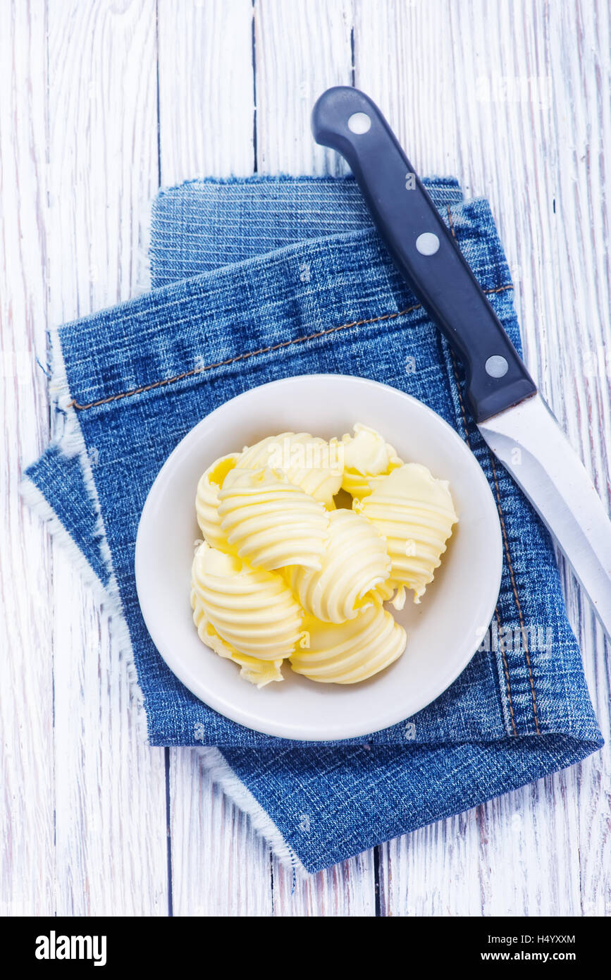 butter on plate and on a table Stock Photo - Alamy