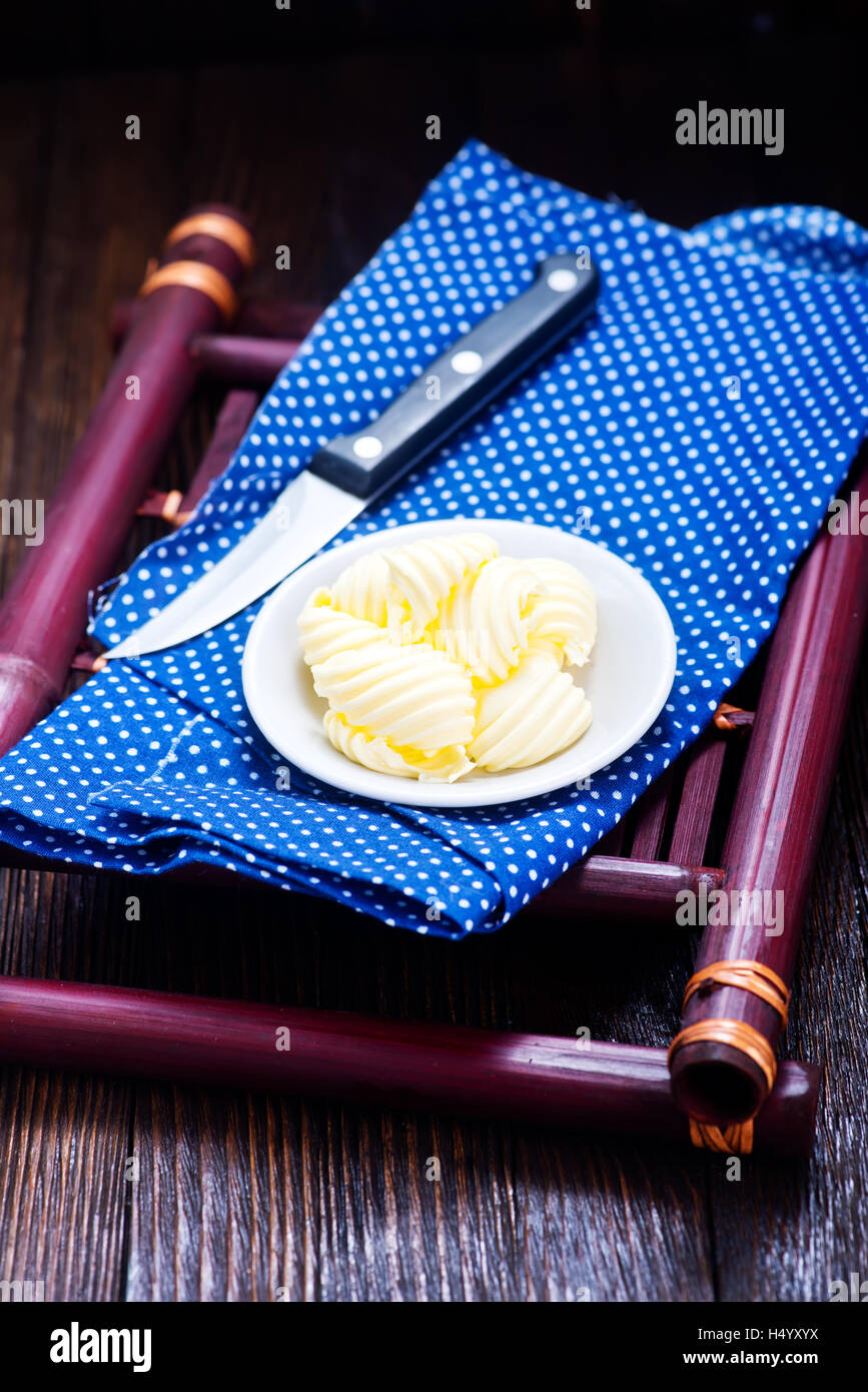 butter on plate and on a table Stock Photo - Alamy