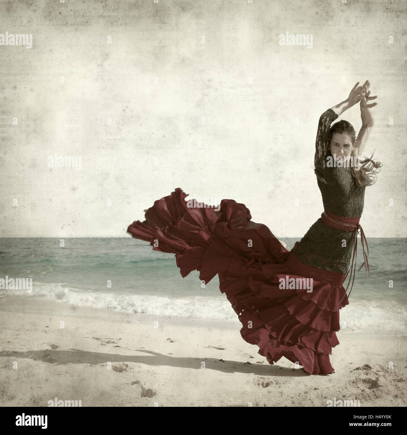 textured old paper background with flamenco dancer by the ocean shore ...