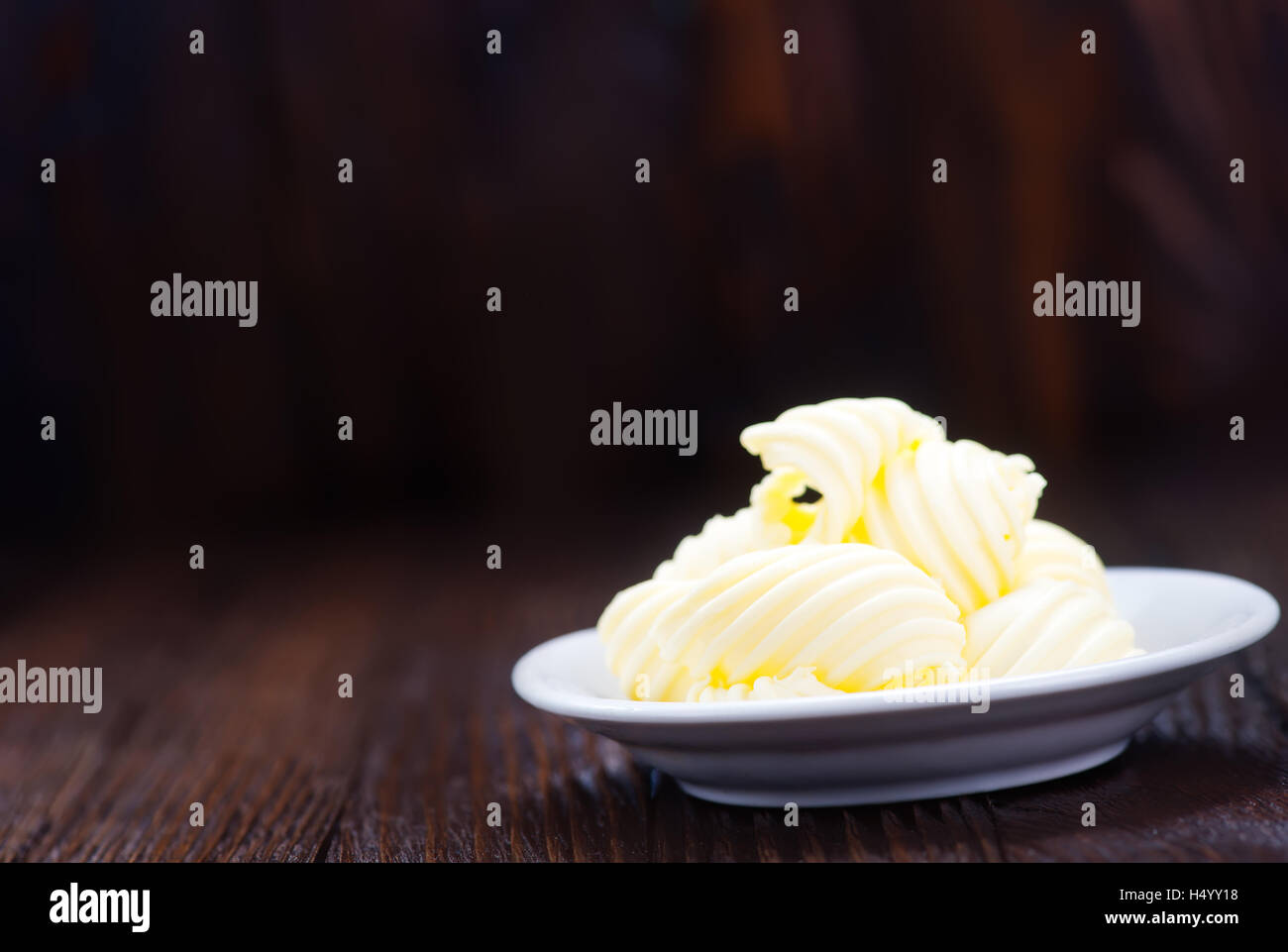 butter on plate and on a table Stock Photo - Alamy