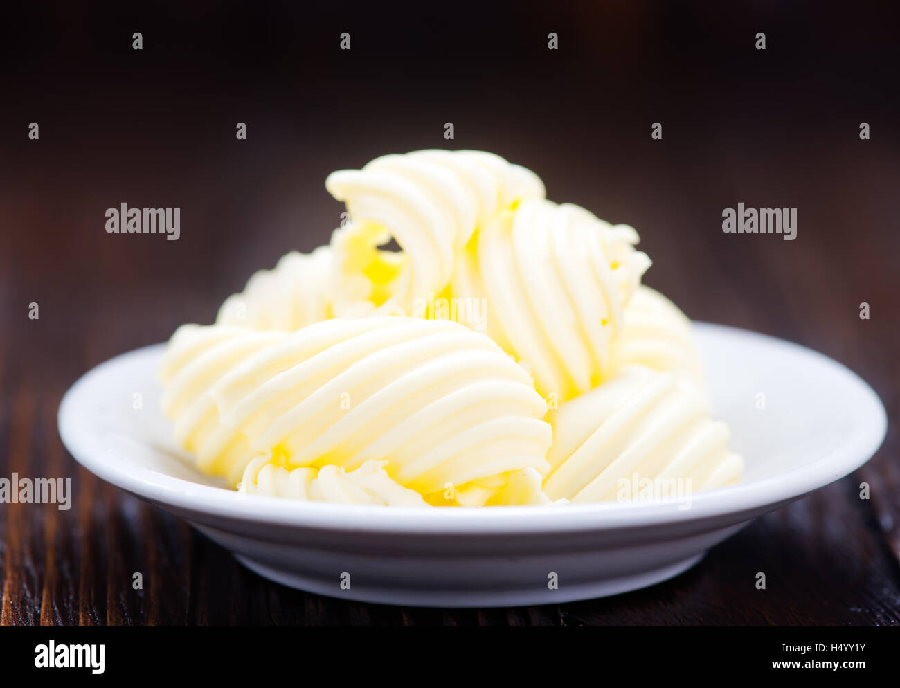 butter on plate and on a table Stock Photo - Alamy