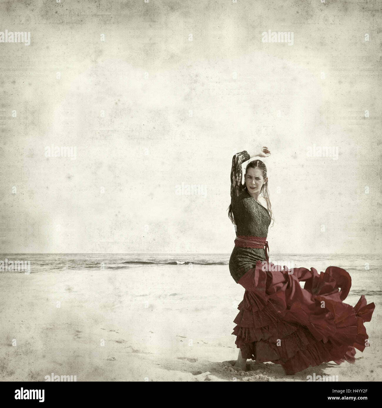 textured old paper background with flamenco dancer by the ocean shore ...