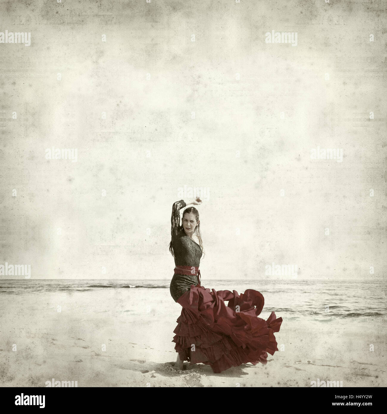 textured old paper background with flamenco dancer by the ocean shore ...
