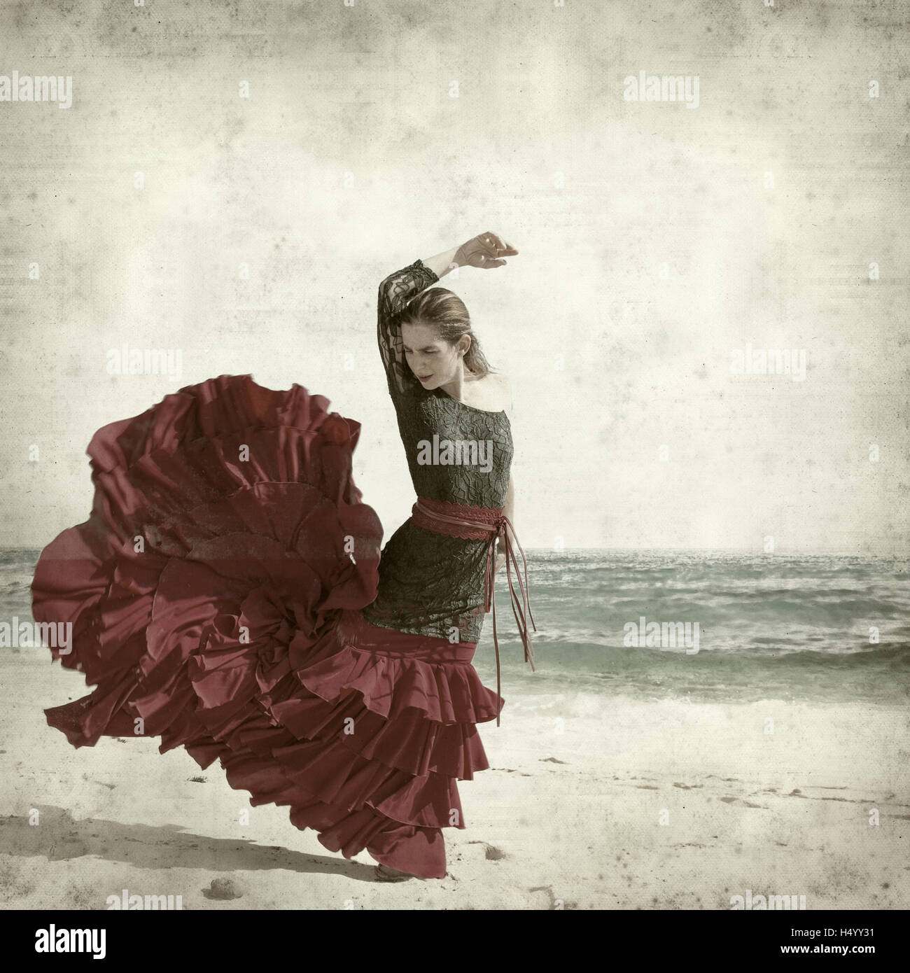 textured old paper background with flamenco dancer by the ocean shore ...