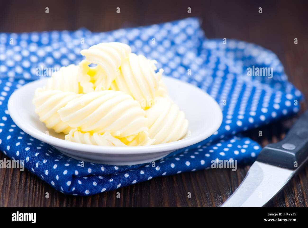 butter on plate and on a table Stock Photo - Alamy