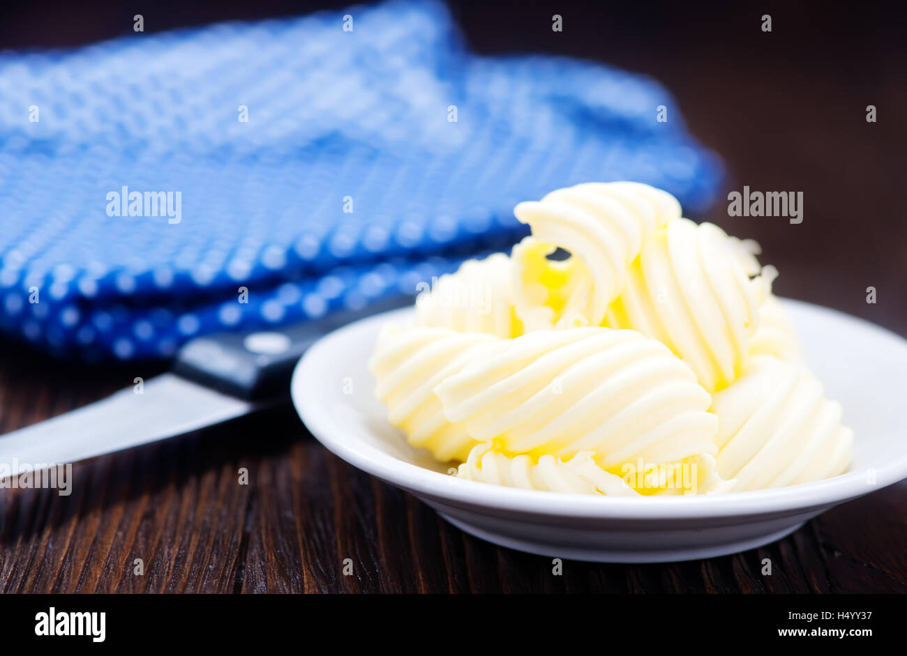 butter on plate and on a table Stock Photo - Alamy