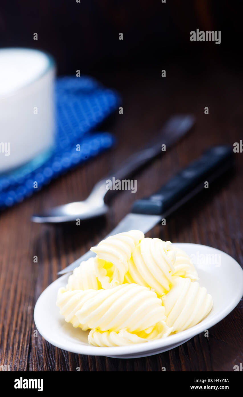 butter on plate and on a table Stock Photo - Alamy