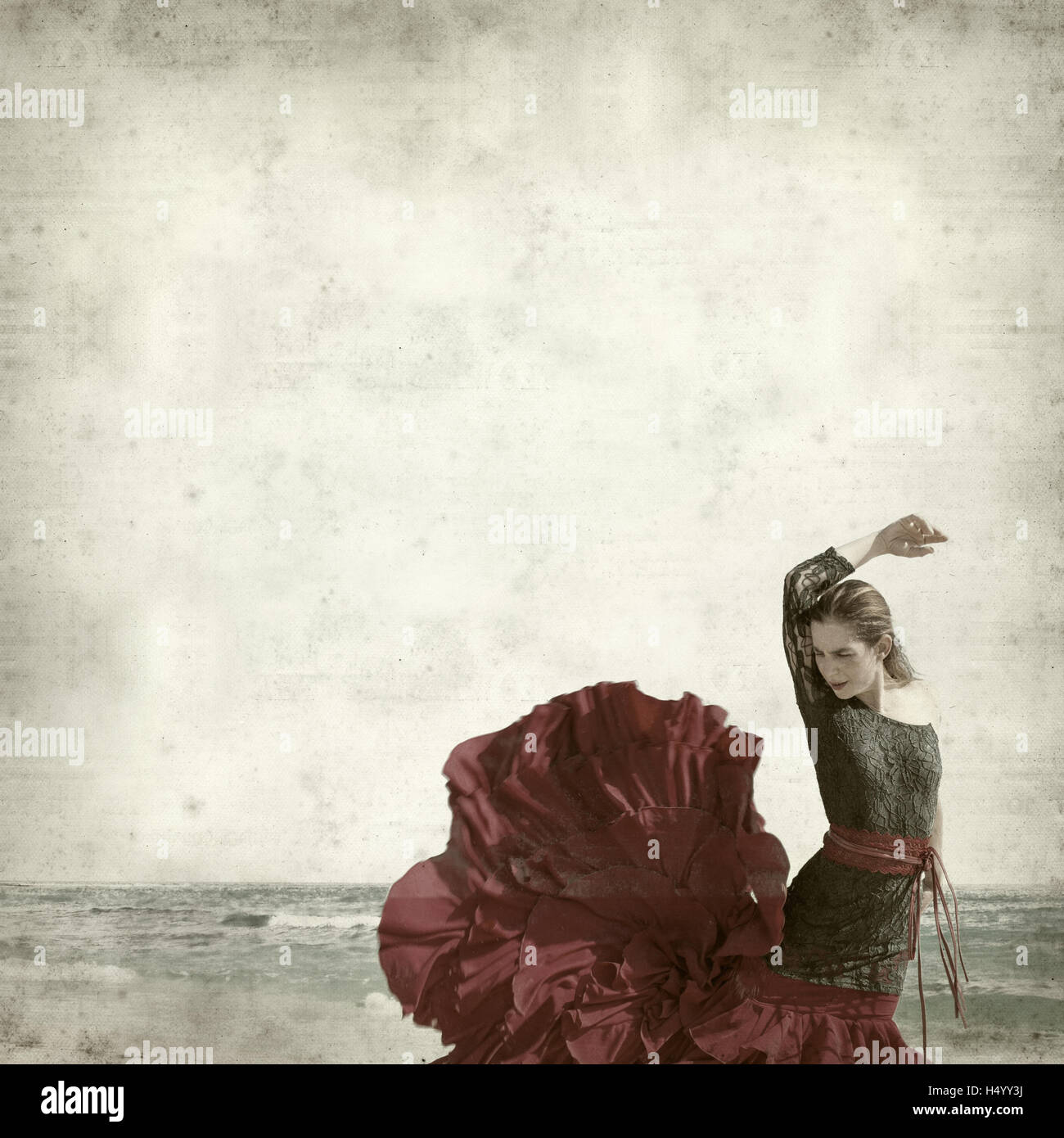 textured old paper background with flamenco dancer by the ocean shore ...