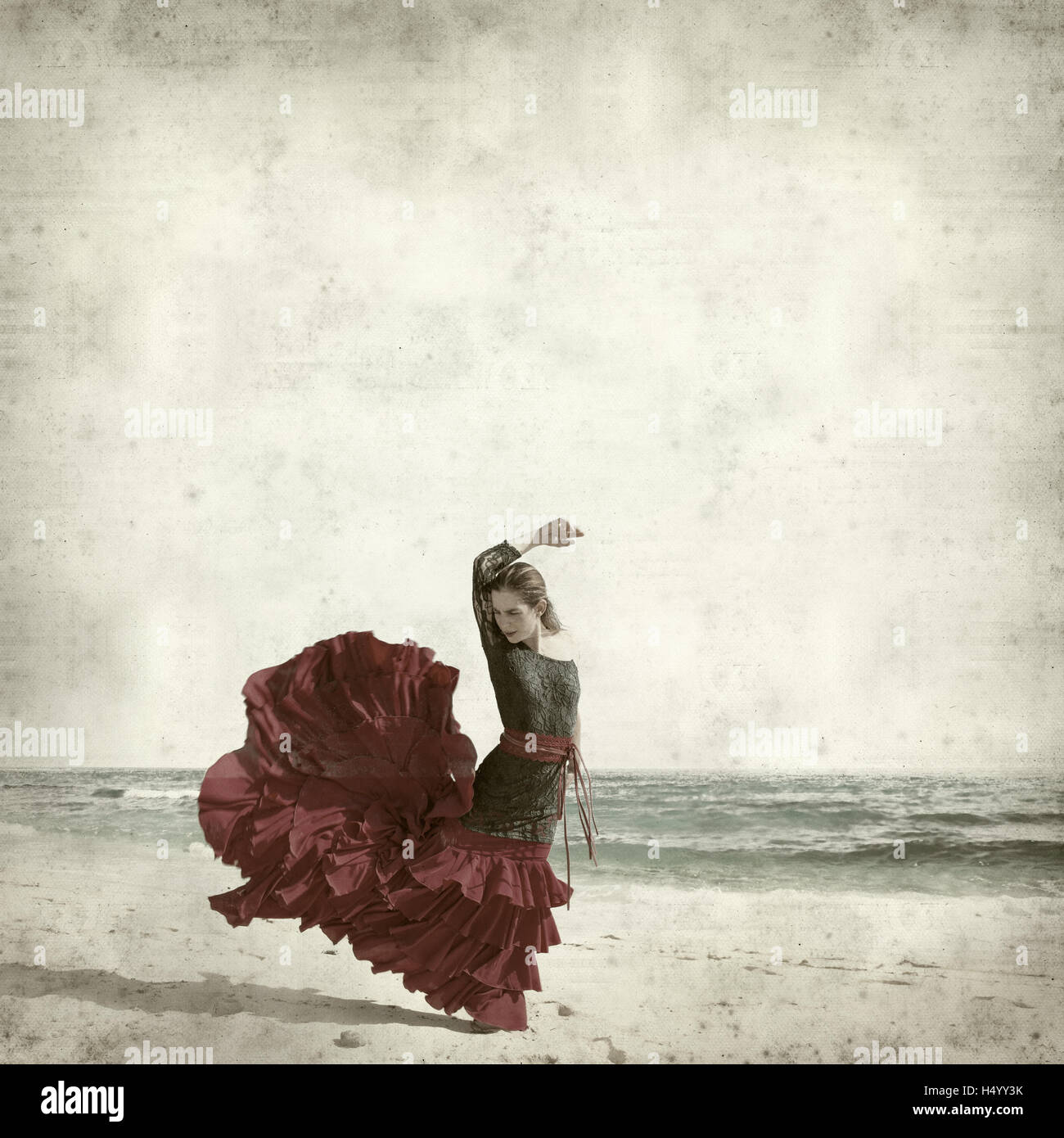 textured old paper background with flamenco dancer by the ocean shore ...
