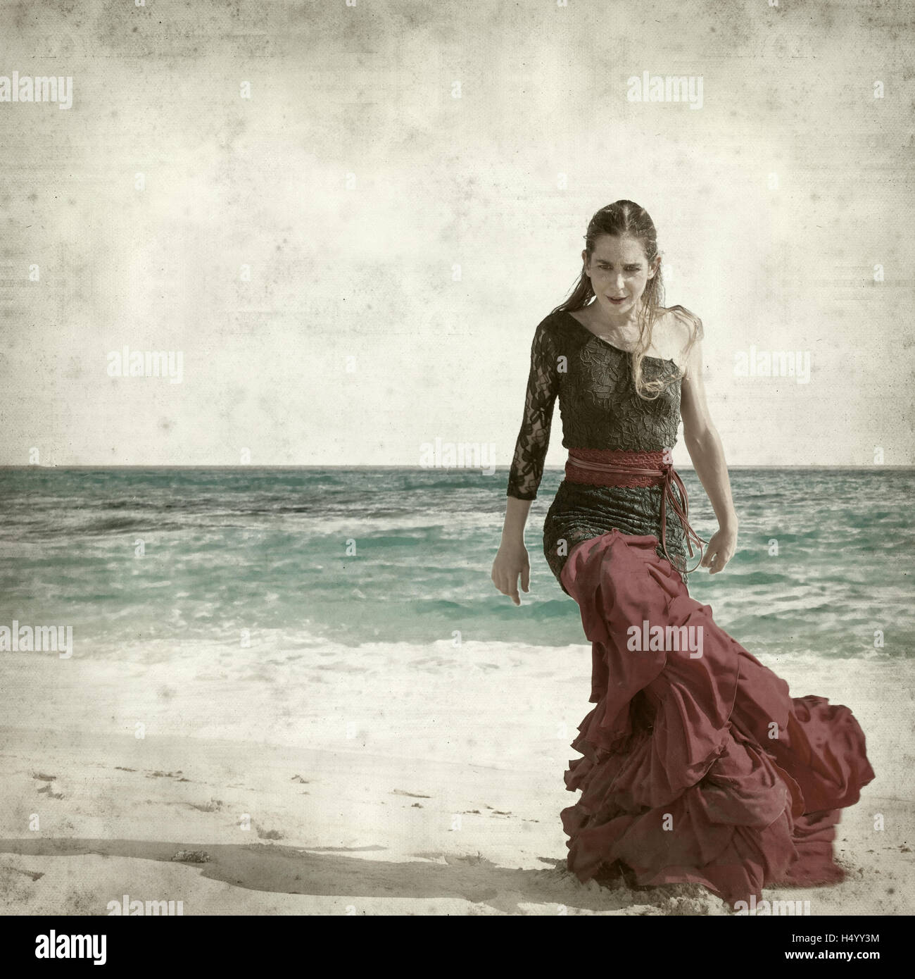 textured old paper background with flamenco dancer by the ocean shore ...