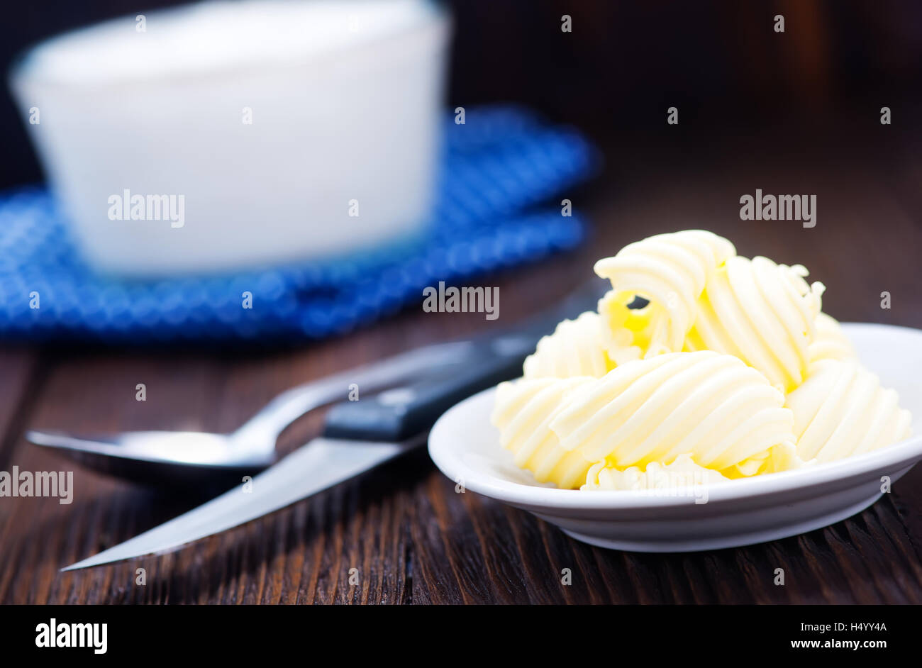 butter on plate and on a table Stock Photo - Alamy
