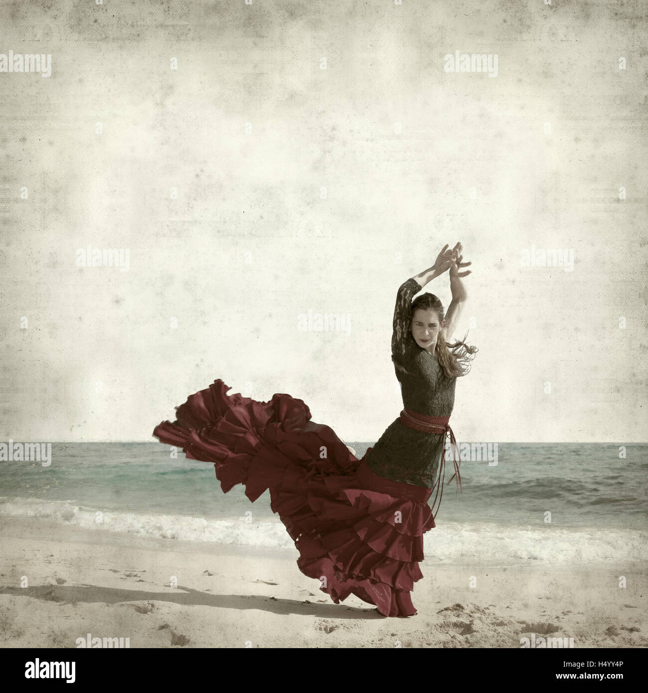 textured old paper background with flamenco dancer by the ocean shore ...