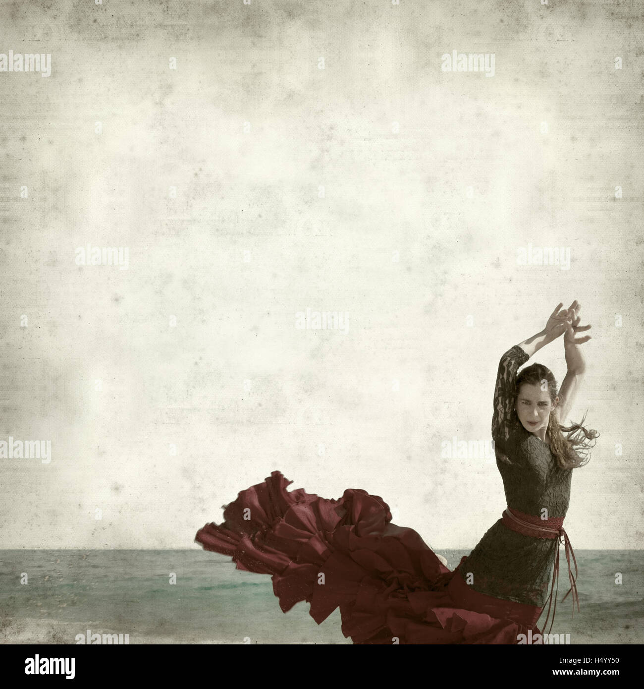 textured old paper background with flamenco dancer by the ocean shore ...