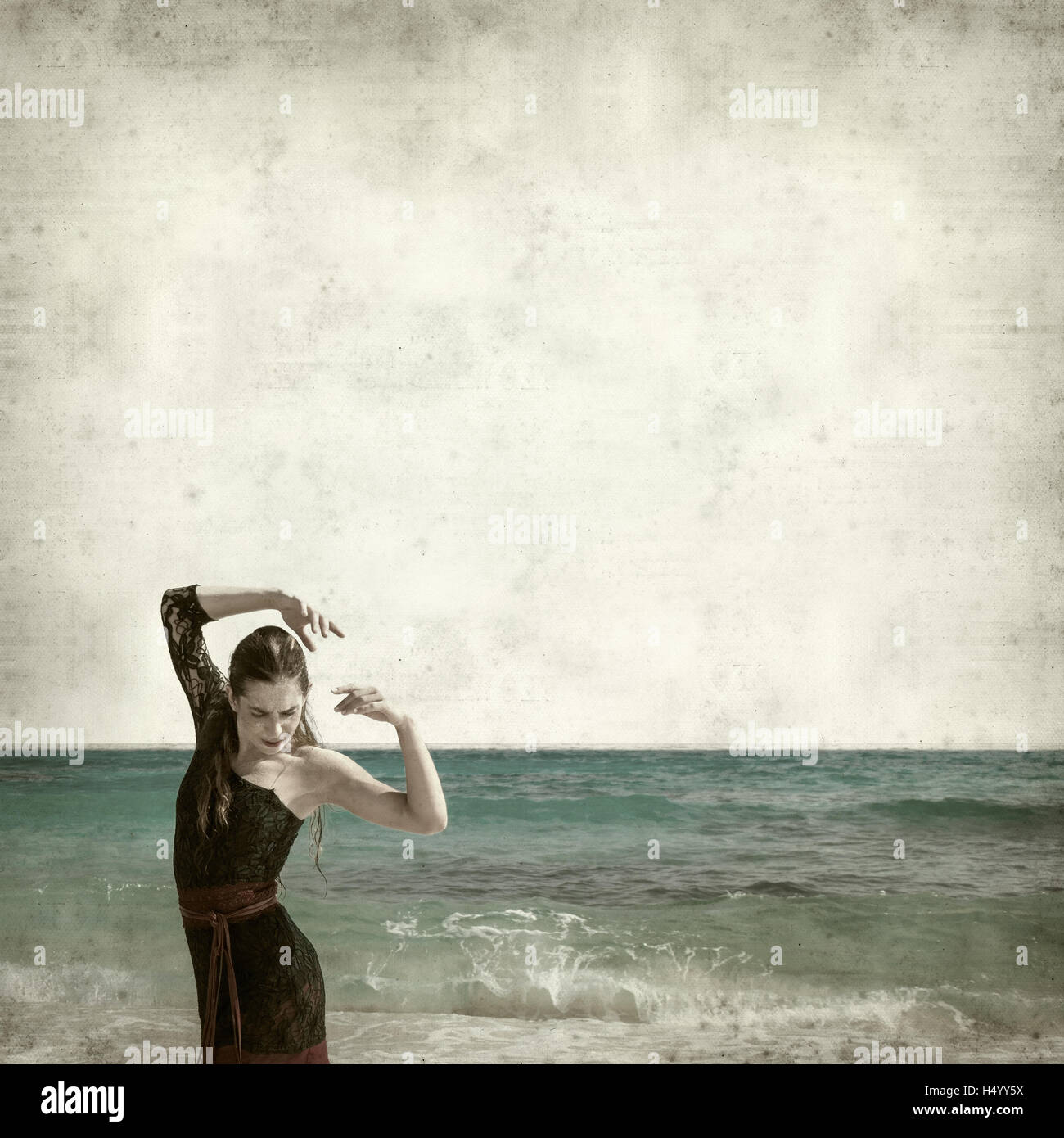 textured old paper background with flamenco dancer by the ocean shore ...