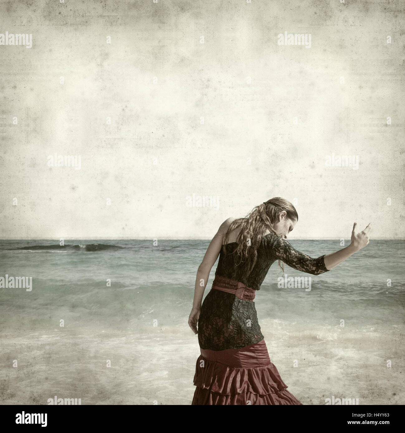 textured old paper background with flamenco dancer by the ocean shore ...