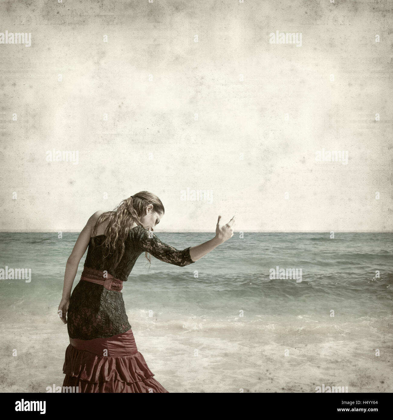 textured old paper background with flamenco dancer by the ocean shore ...