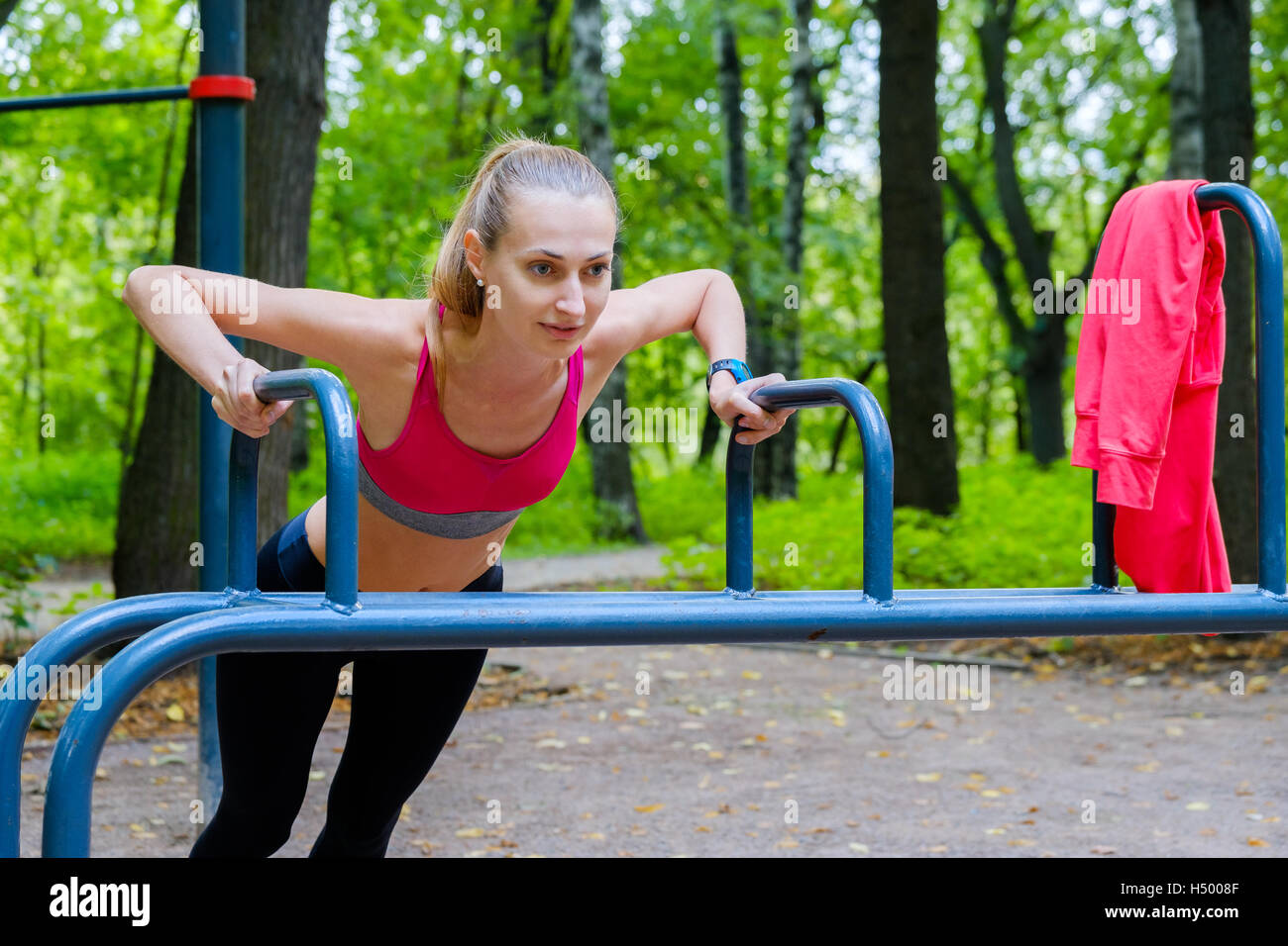 Young slim woman doing workout in a training ground Stock Photo - Alamy