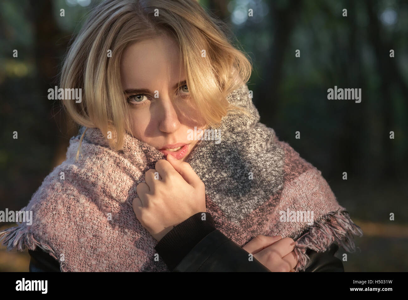 sad girl in scarf looking at camera outdoor Stock Photo - Alamy