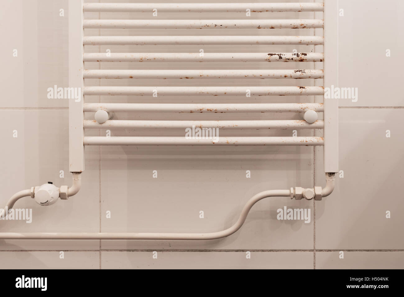 Rusty household cast iron radiator, in need of some TLC Stock Photo - Alamy