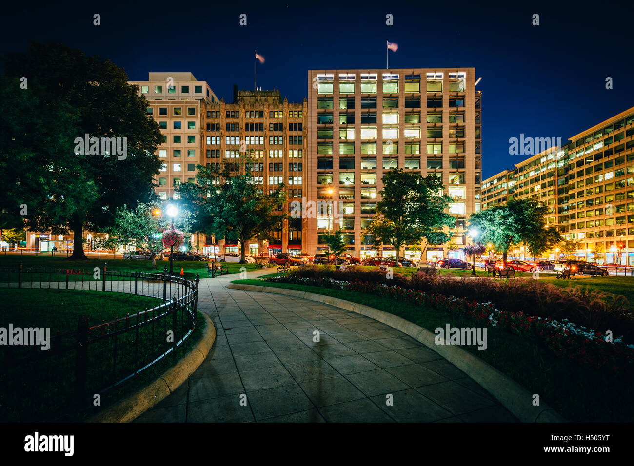Walkway and buildings at Farragut Square at night, in Washington, DC ...
