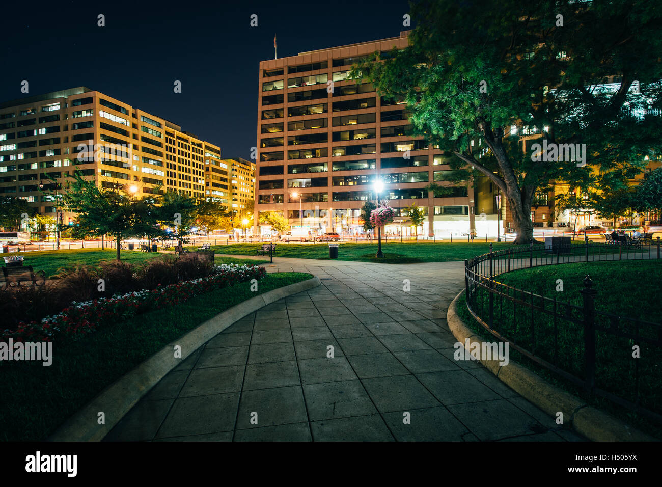 Walkway and buildings at Farragut Square at night, in Washington, DC ...