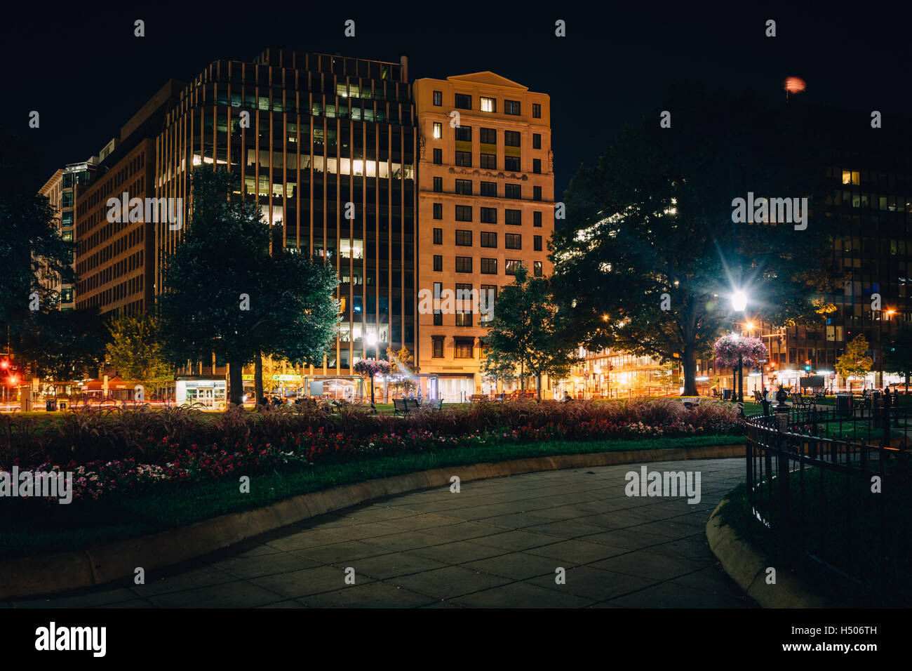 Walkway and buildings at night, at Farragut Square, in Washington, DC ...