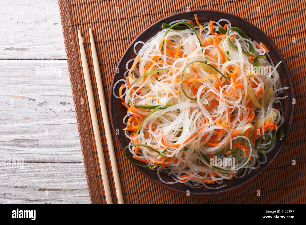 Asian crystal noodles with cucumber and carrot on a plate horizontal ...