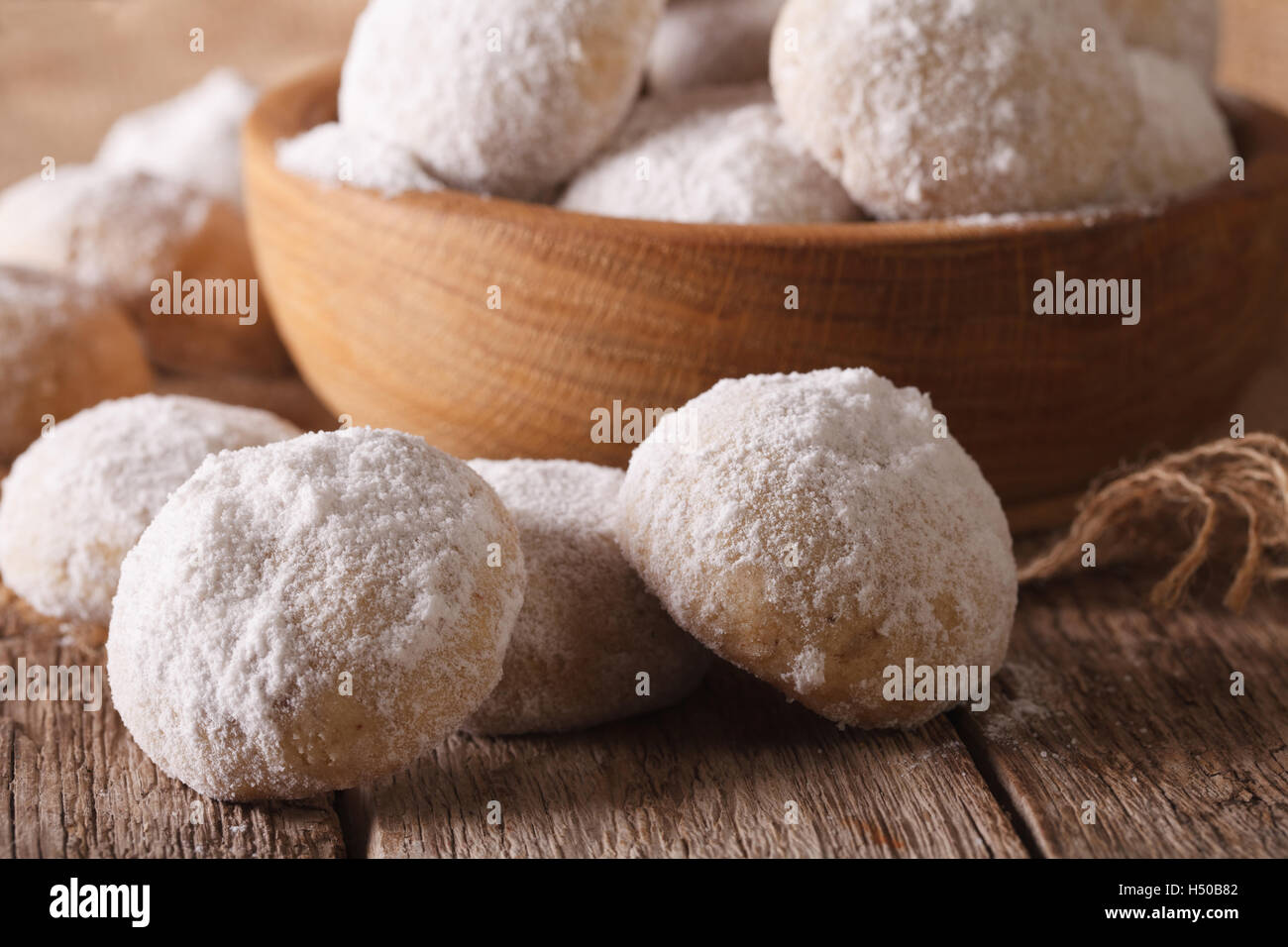 Mexican wedding cookies polvoron macro in a wooden bowl. horizontal ...