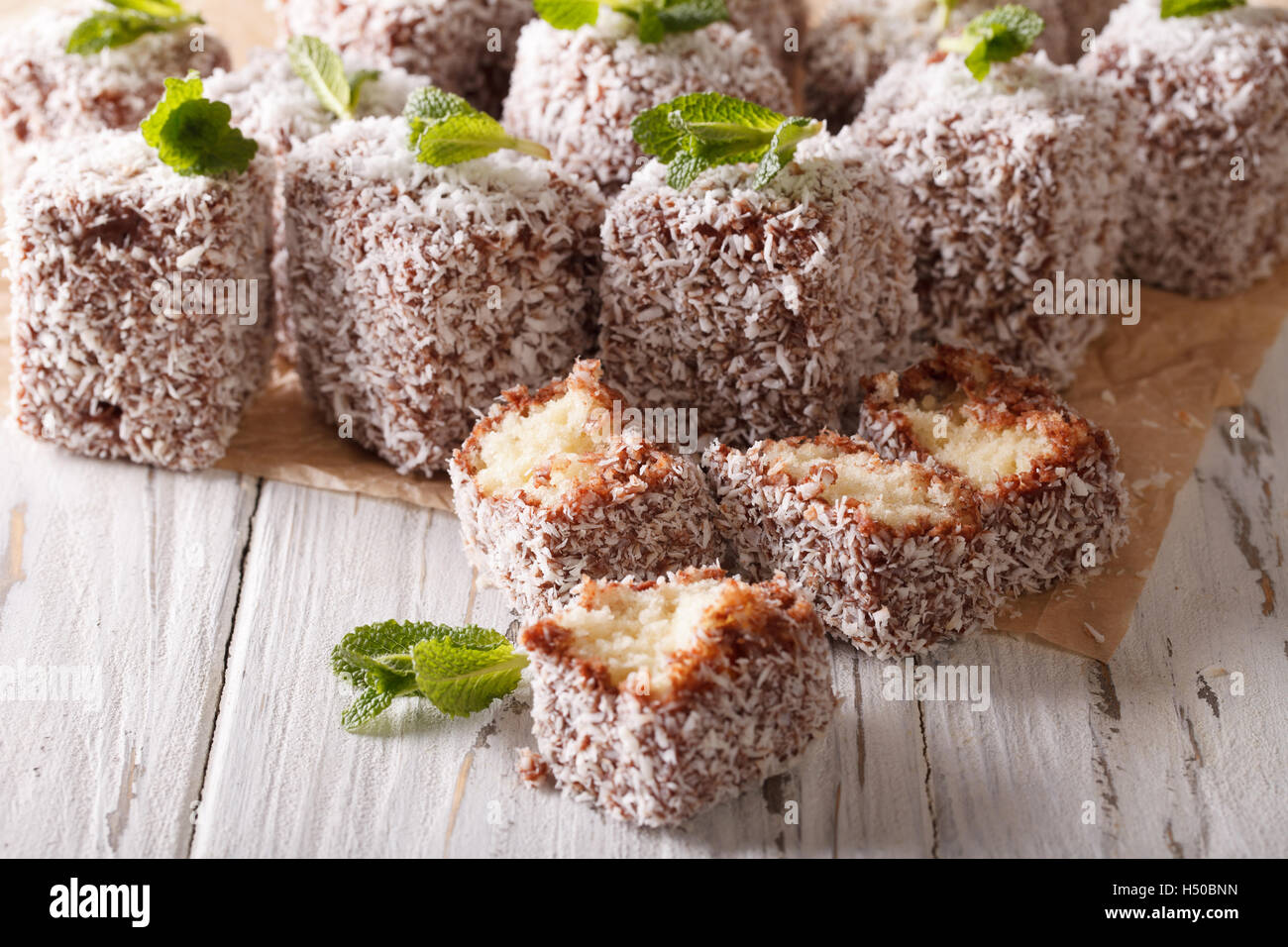 Australian Lamington cake decorated with mint close up on the table ...