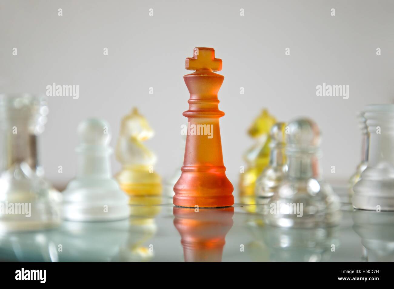 Crystal Glass color Chess piece on a chess board Stock Photo - Alamy