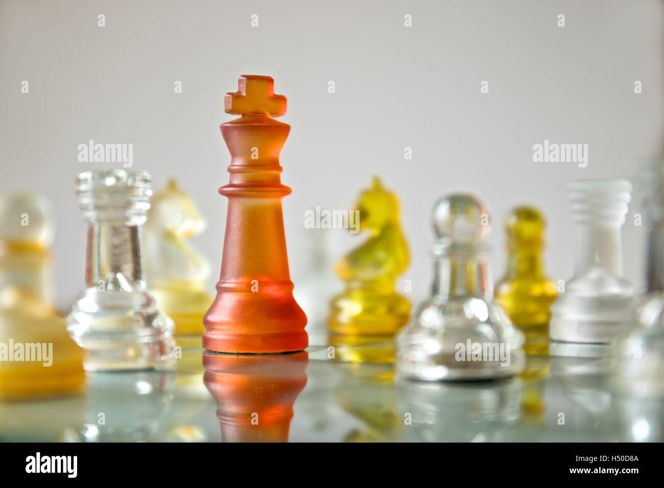 Crystal Glass color Chess piece on a chess board Stock Photo - Alamy