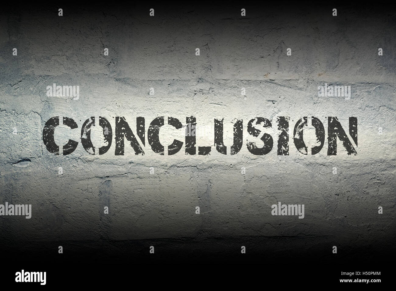 conclusion world stencil print on the grunge white brick wall ...