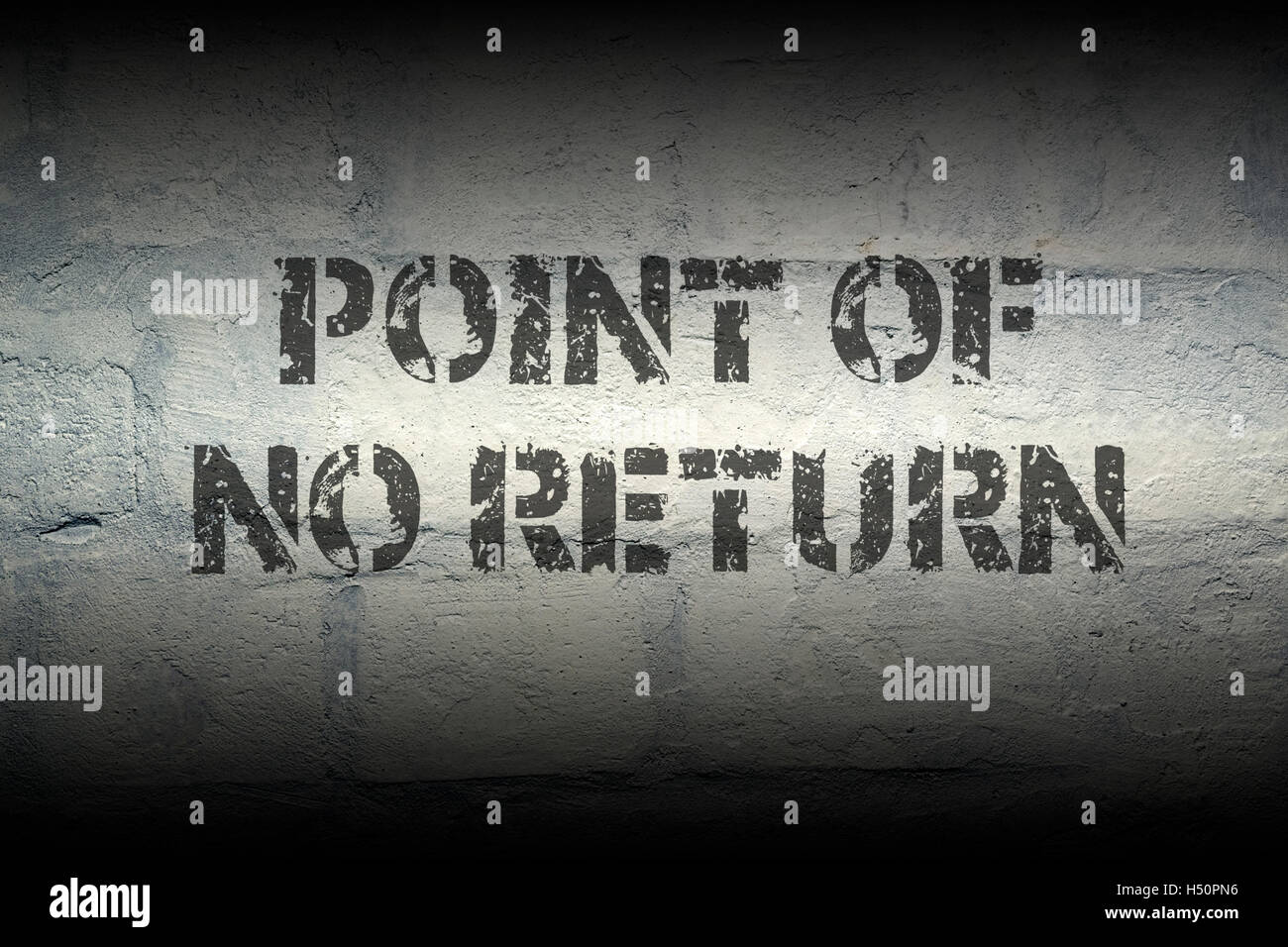 point of no return stencil print on the grunge white brick wall ...