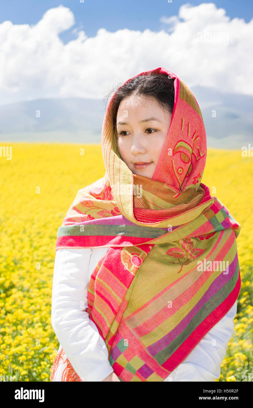 Asian women in rape flower Stock Photo - Alamy