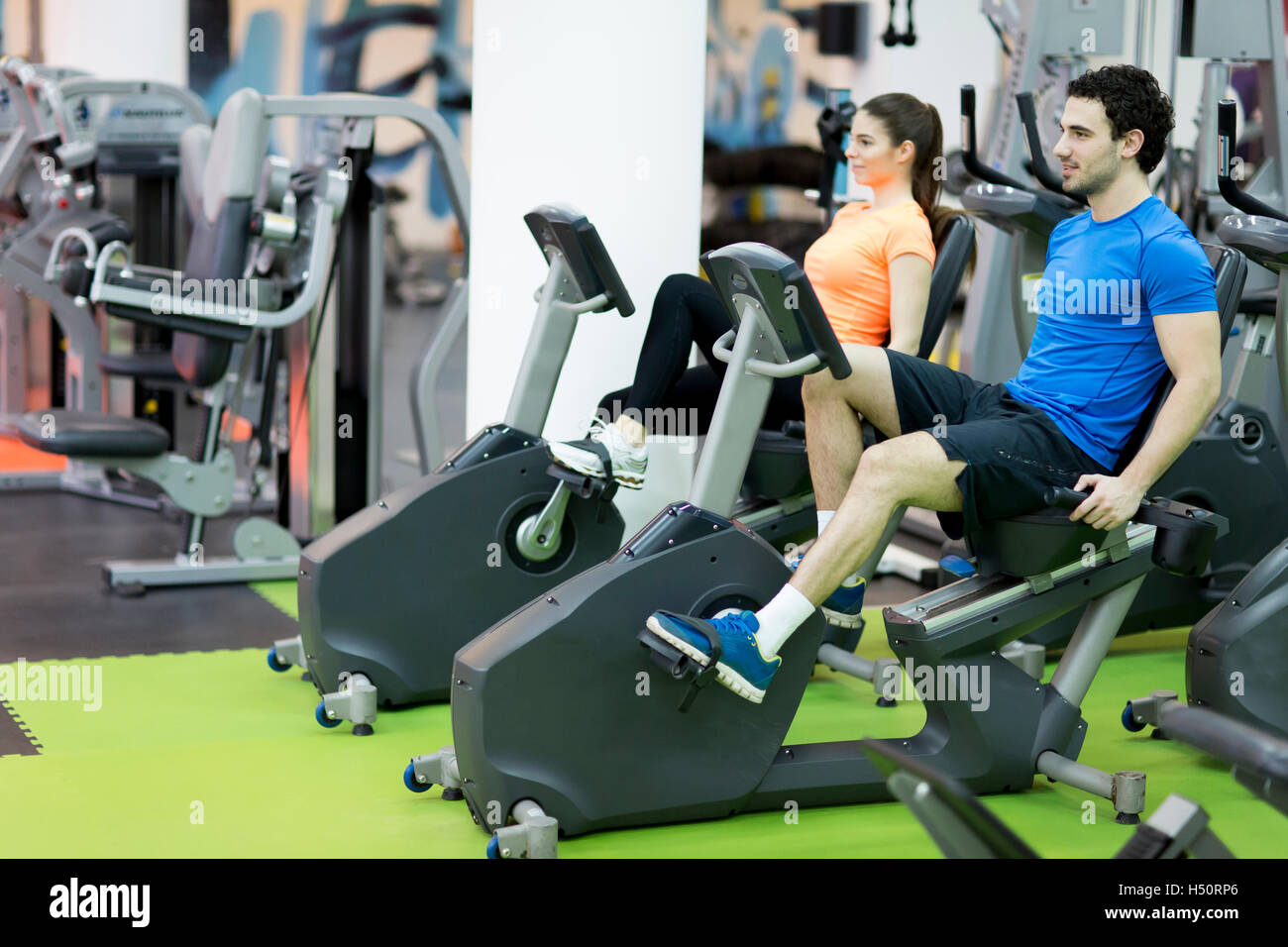 Young people doung workout in the gym Stock Photo - Alamy