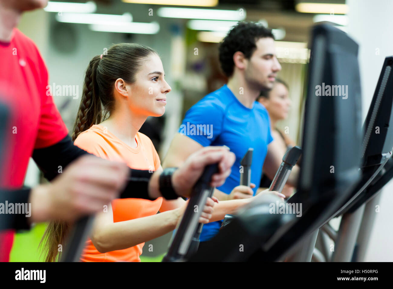 Young people doung workout in the gym Stock Photo - Alamy
